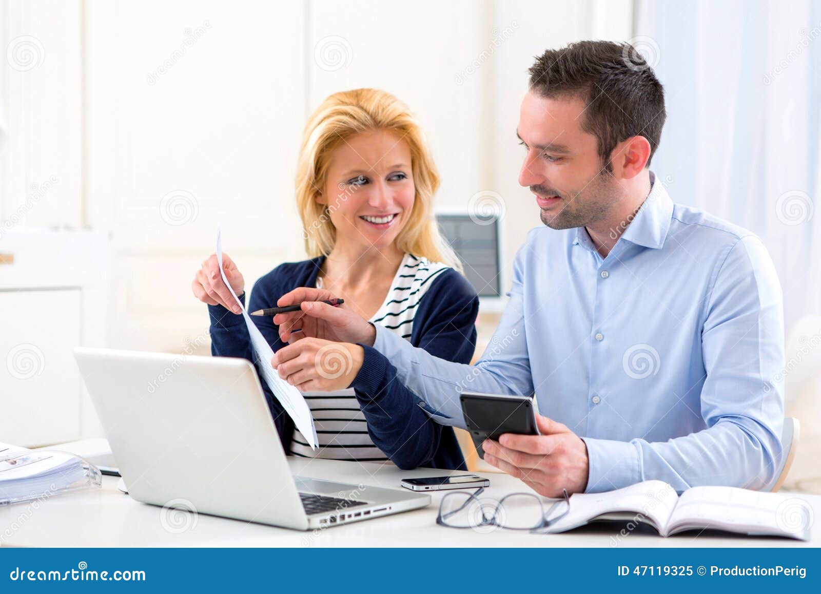 Attractive Couple Doing Administrative Paperwork Stock Image - Image of ...