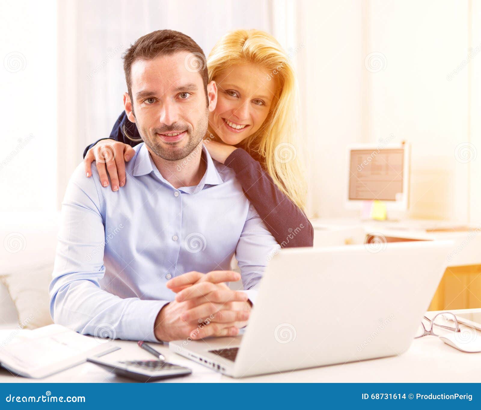 Attractive Couple Doing Administrative Paperwork Stock Photo - Image of ...