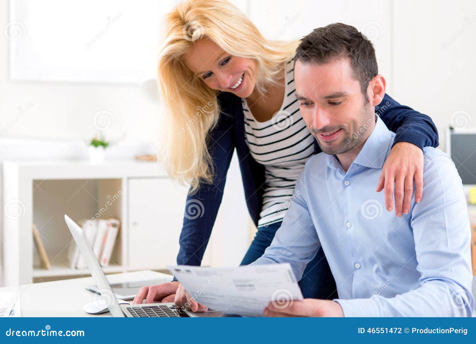 Attractive Couple Doing Administrative Paperwork Stock Photo - Image of ...