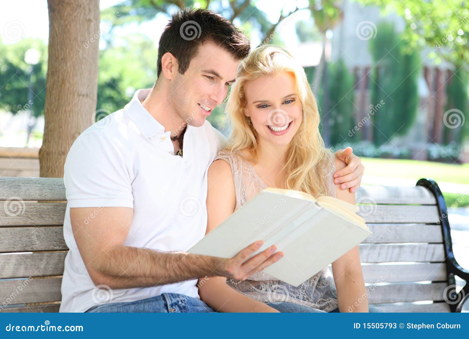 Attractive Couple Reading stock image. Image of bench - 15505793