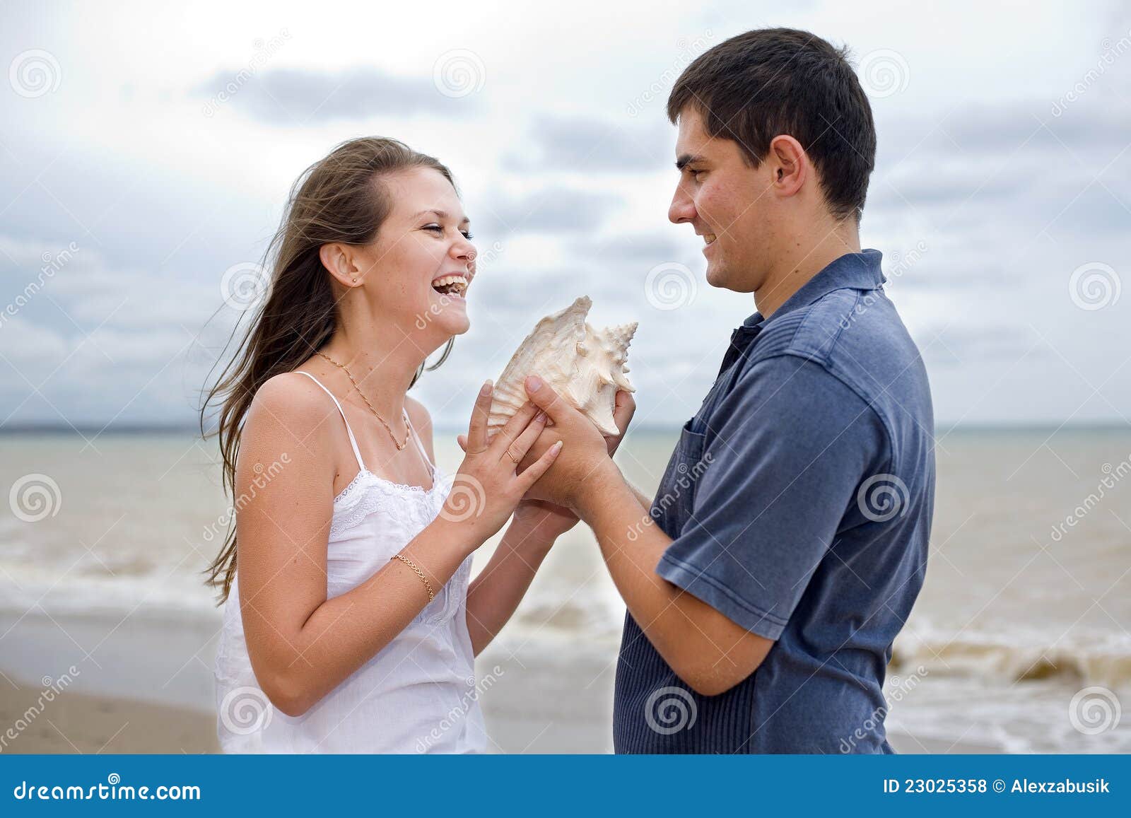 Attractive Couple at the Sea Stock Photo - Image of adult, beach: 23025358