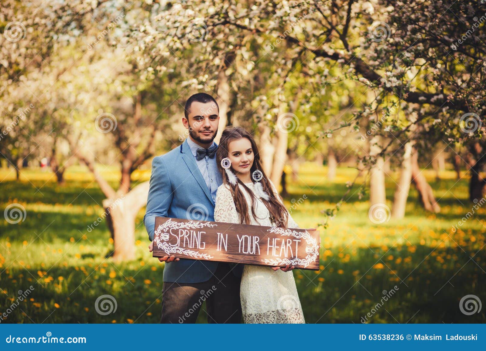 Attractive Couple Standing in the Spring Garden Stock Photo - Image of ...