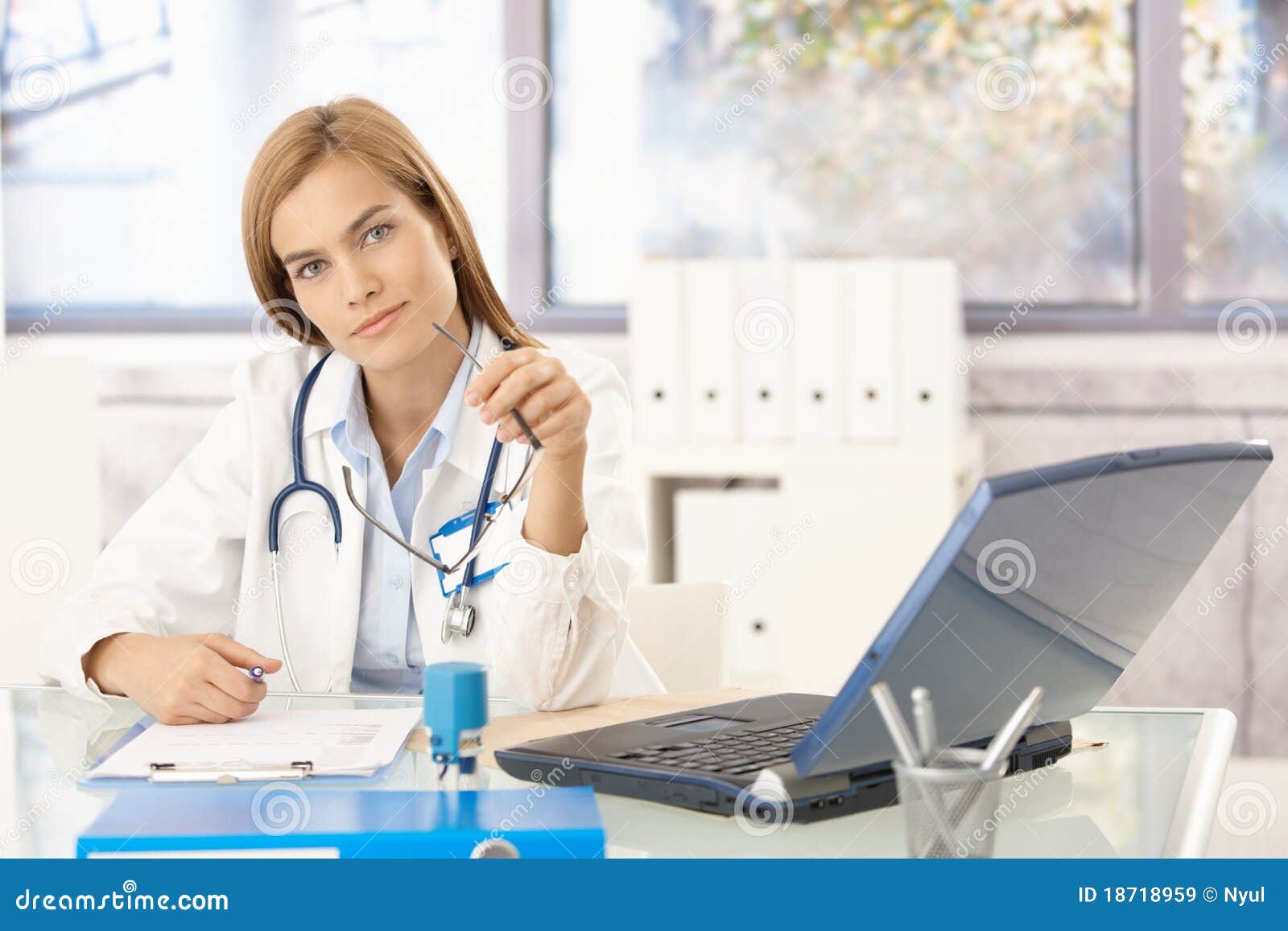 Attractive Doctor Writing Report Sitting at Desk Stock Image - Image of ...