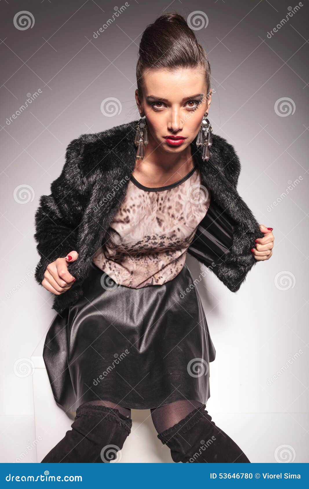 Attractive Fashion Woman Pulling Her Jacket Stock Photo - Image of ...