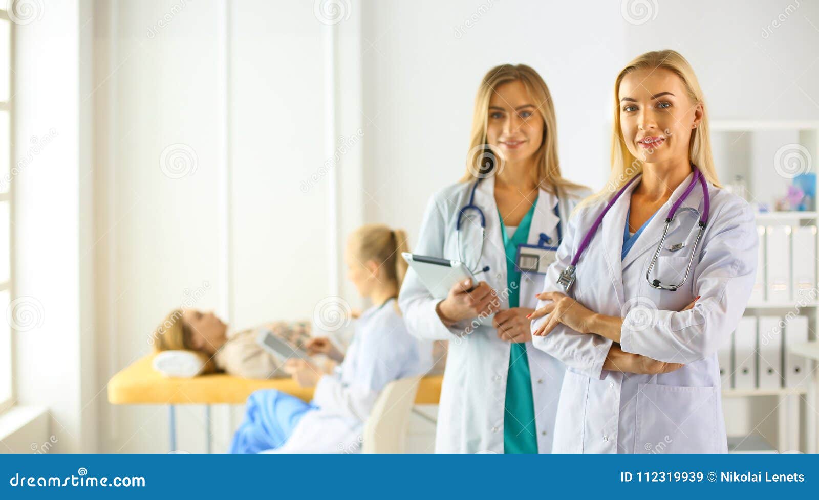 Attractive Female Doctor in Front of Medical Group Stock Image - Image ...