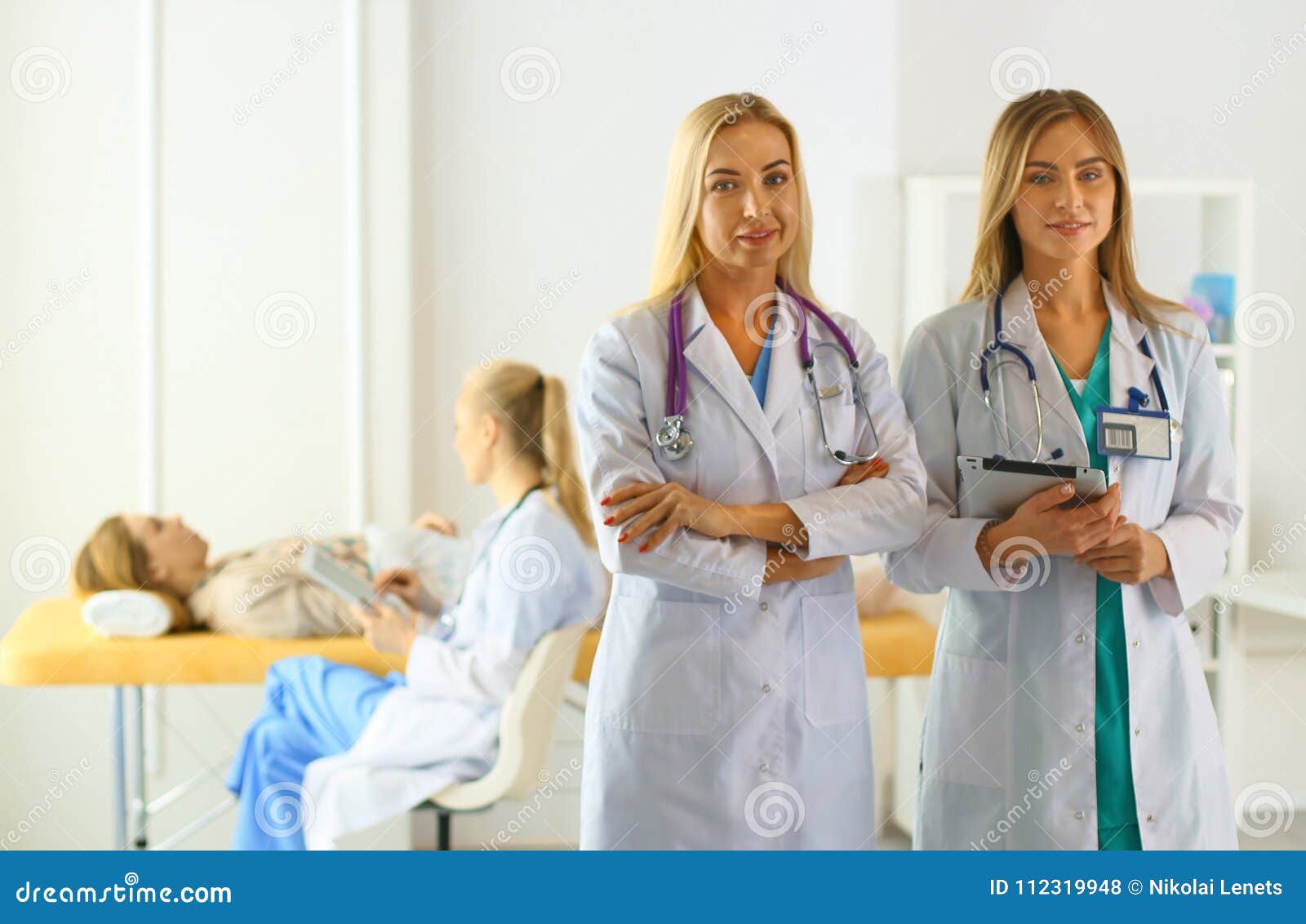 Attractive Female Doctor in Front of Medical Group Stock Photo - Image ...
