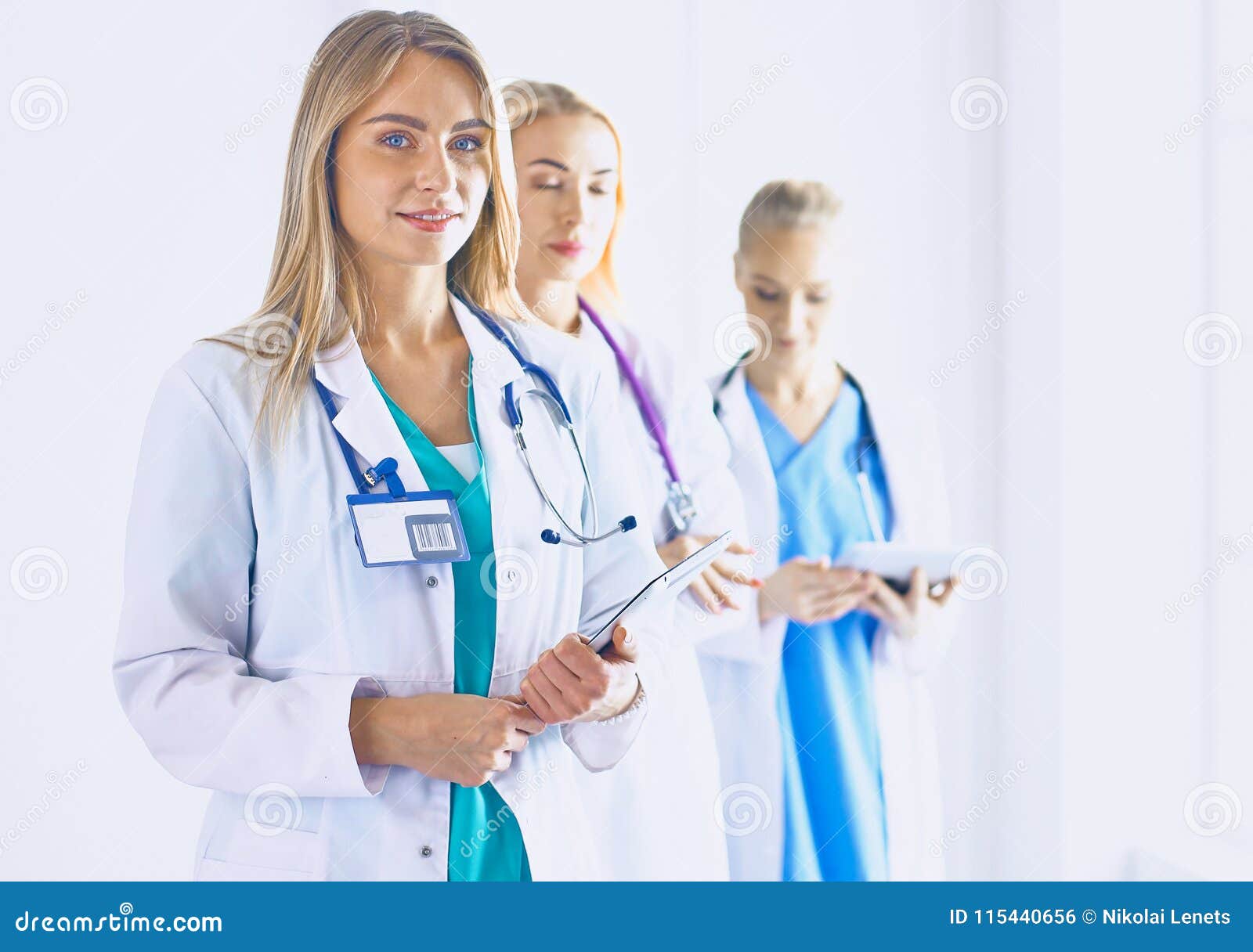 Attractive Female Doctor in Front of Medical Group Stock Photo - Image ...