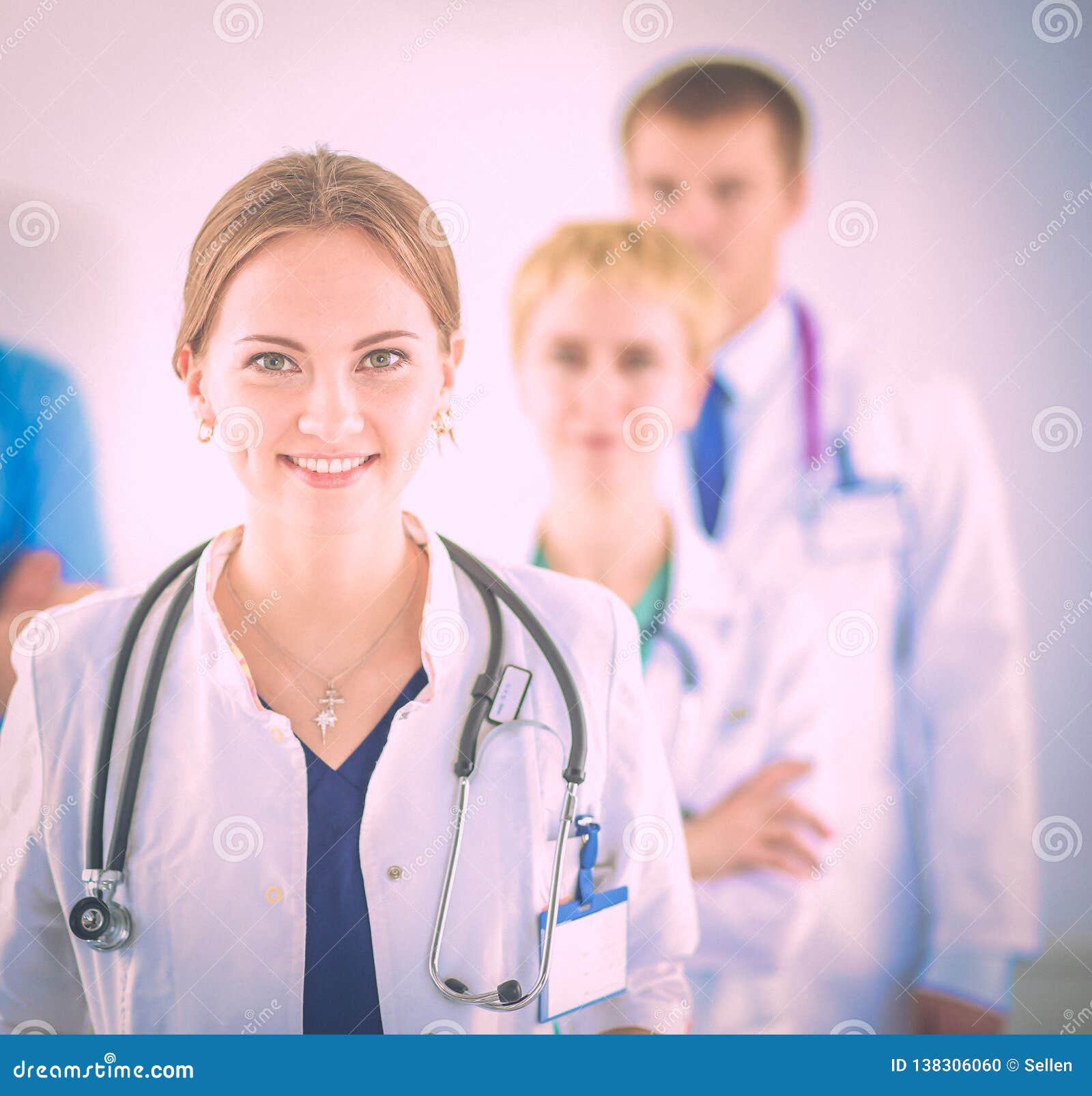 Attractive Female Doctor in Front of Medical Group Stock Photo - Image ...