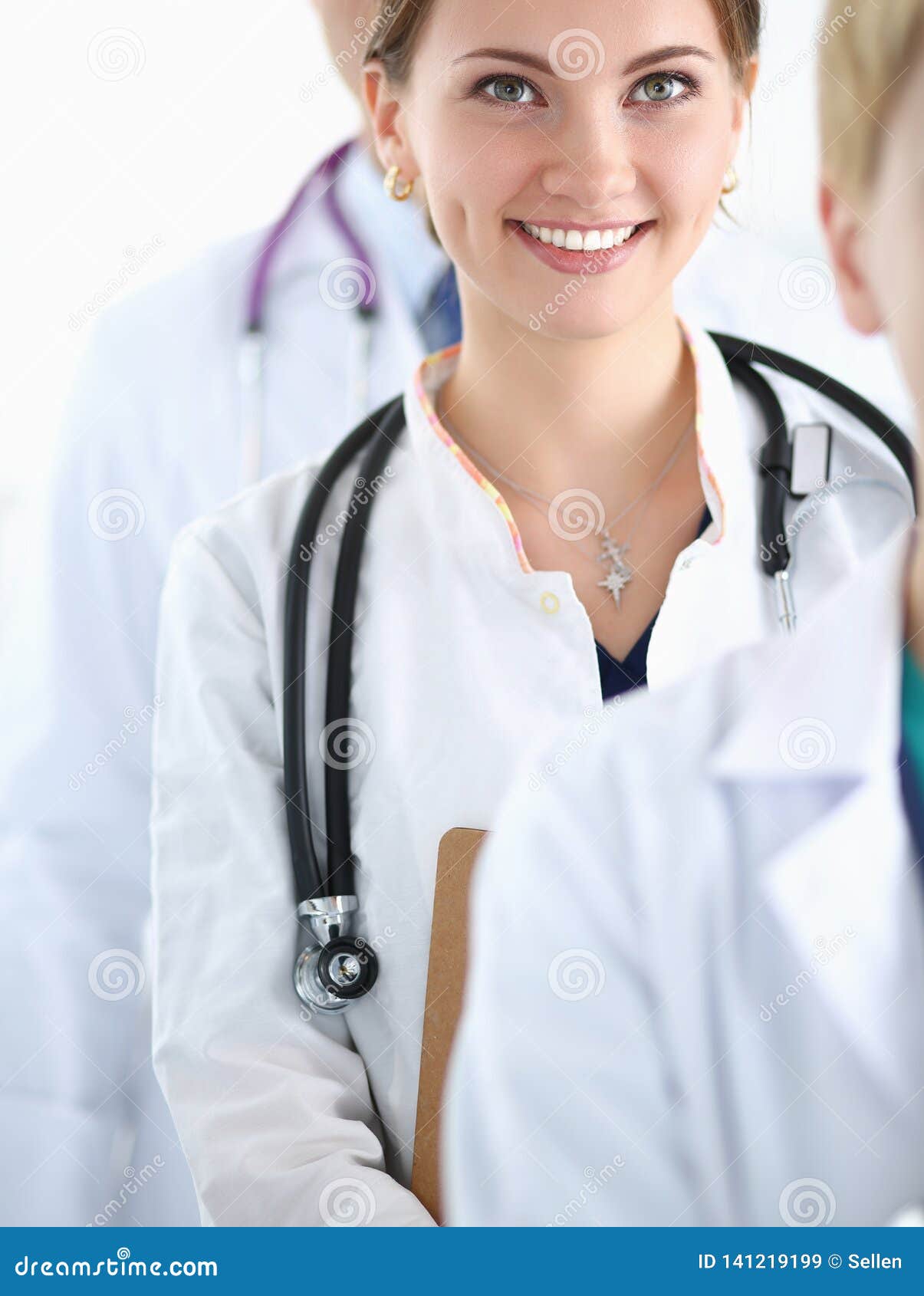 Attractive Female Doctor in Front of Medical Group Stock Image - Image ...
