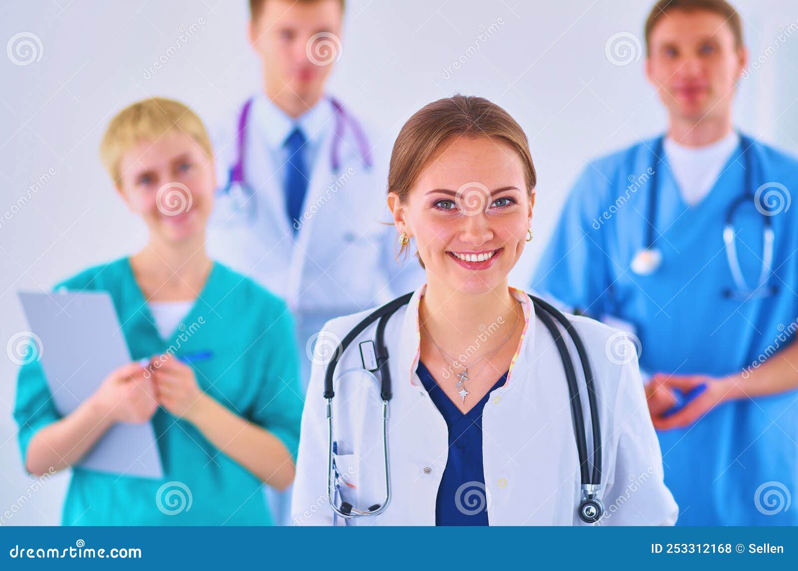 Attractive Female Doctor in Front of Medical Group Stock Photo - Image ...