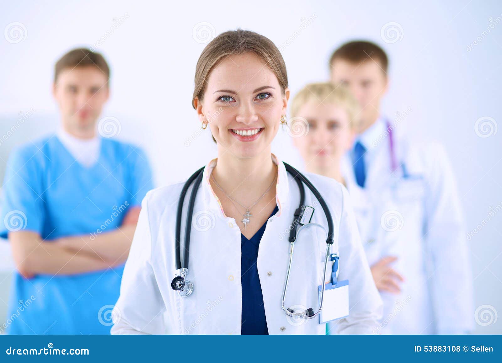 Attractive Female Doctor in Front of Medical Group Stock Photo - Image ...