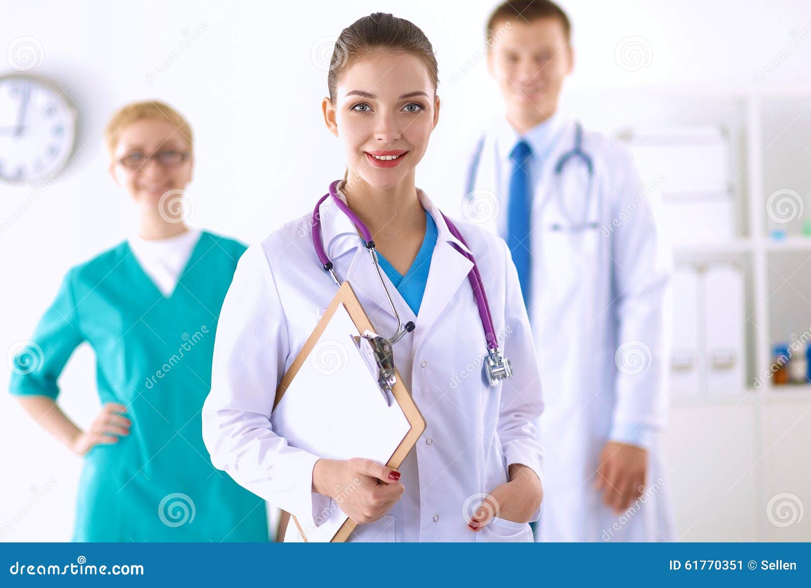 Attractive Female Doctor in Front of Medical Group Stock Image - Image ...