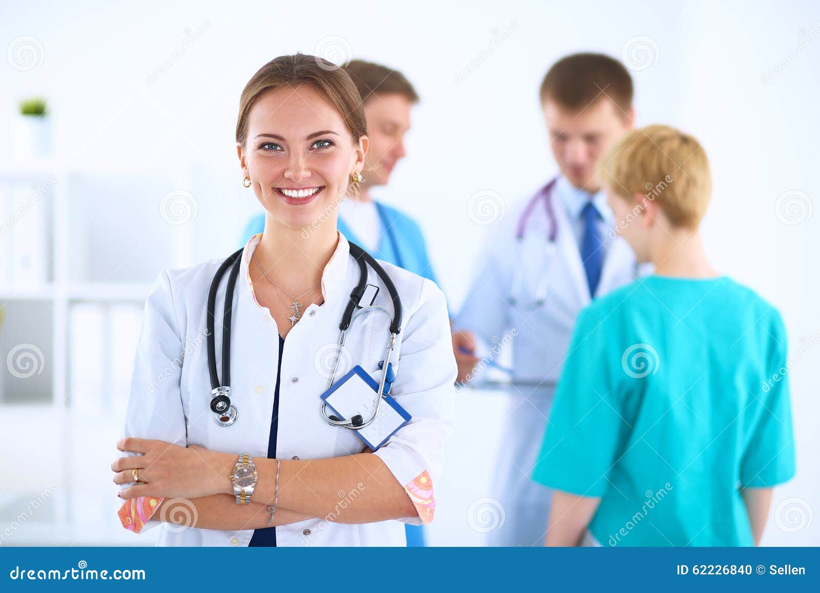 Attractive Female Doctor in Front of Medical Group Stock Photo - Image ...