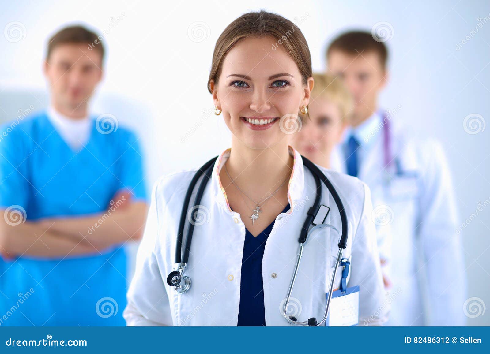 Attractive Female Doctor in Front of Medical Group Stock Photo - Image ...