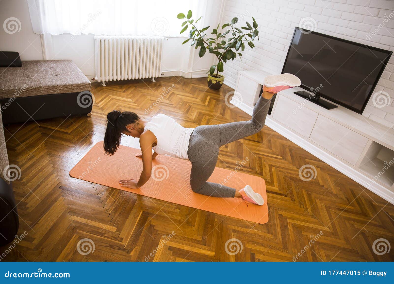 Attractive Female Doing Exercise in Her Living Room Stock Image - Image ...