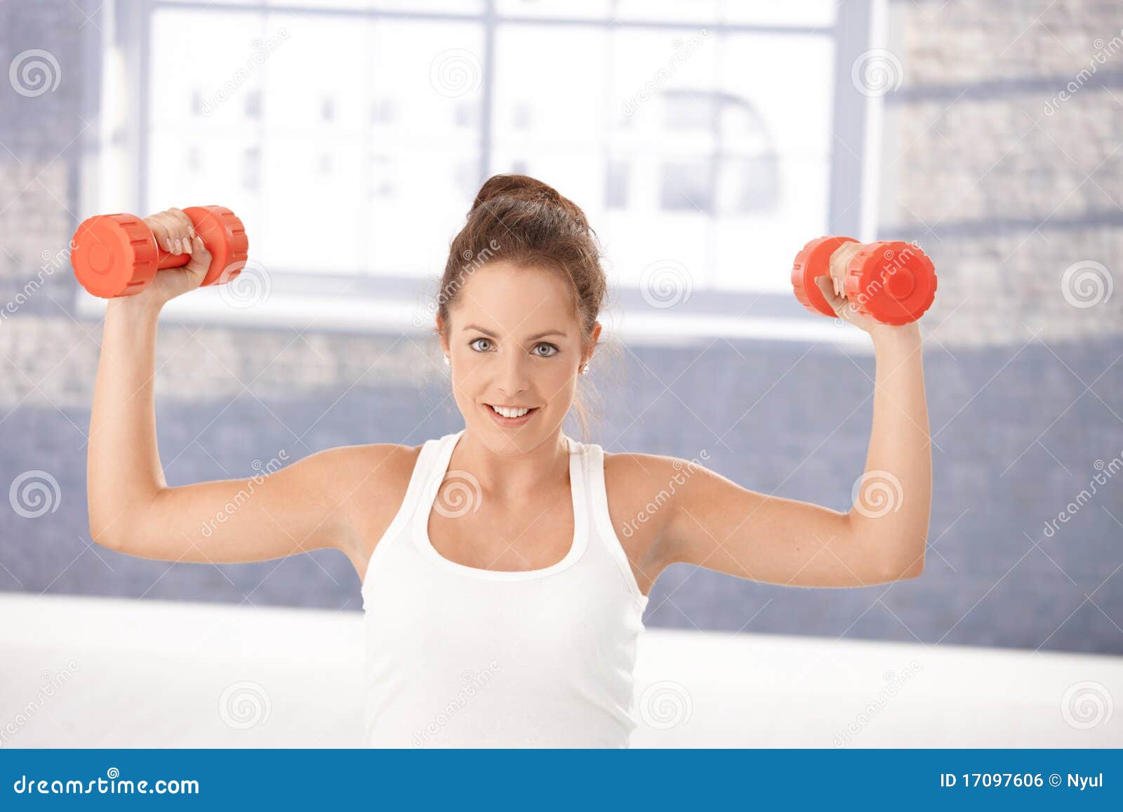 Attractive Female Exercising with Dumbbells Stock Photo - Image of ...
