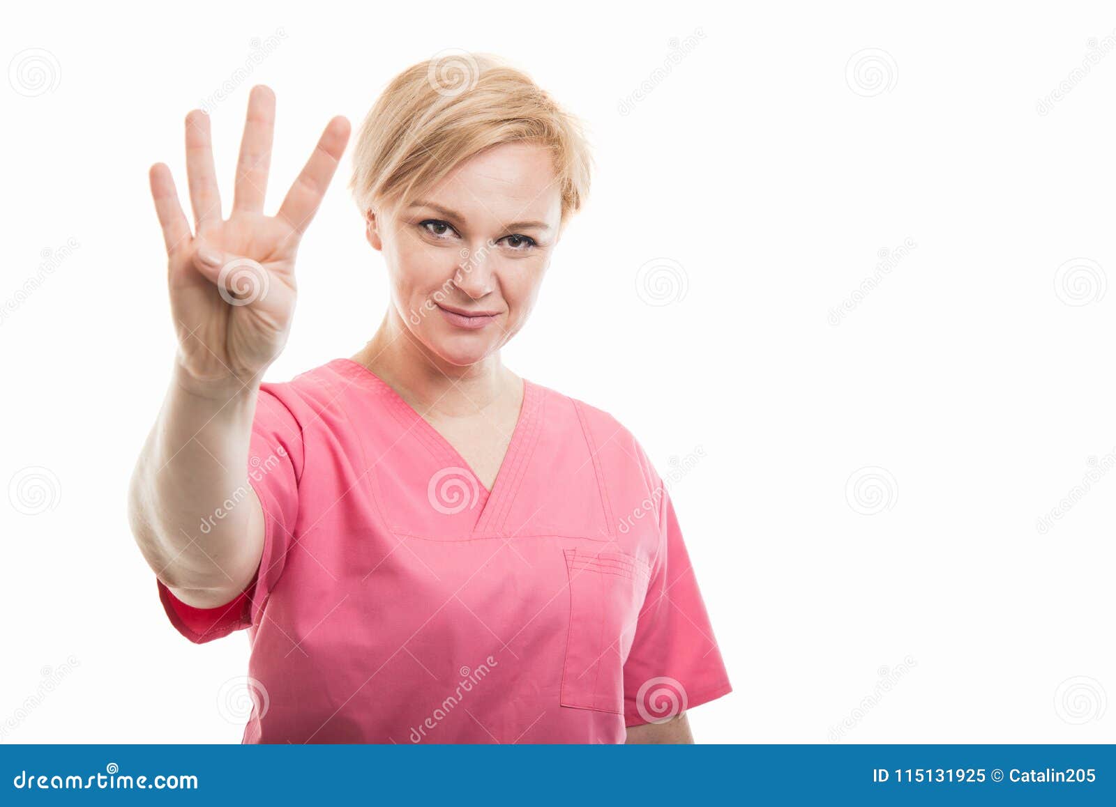 Attractive Female Nurse Wearing Pink Scrubs Showing Number Four Stock
