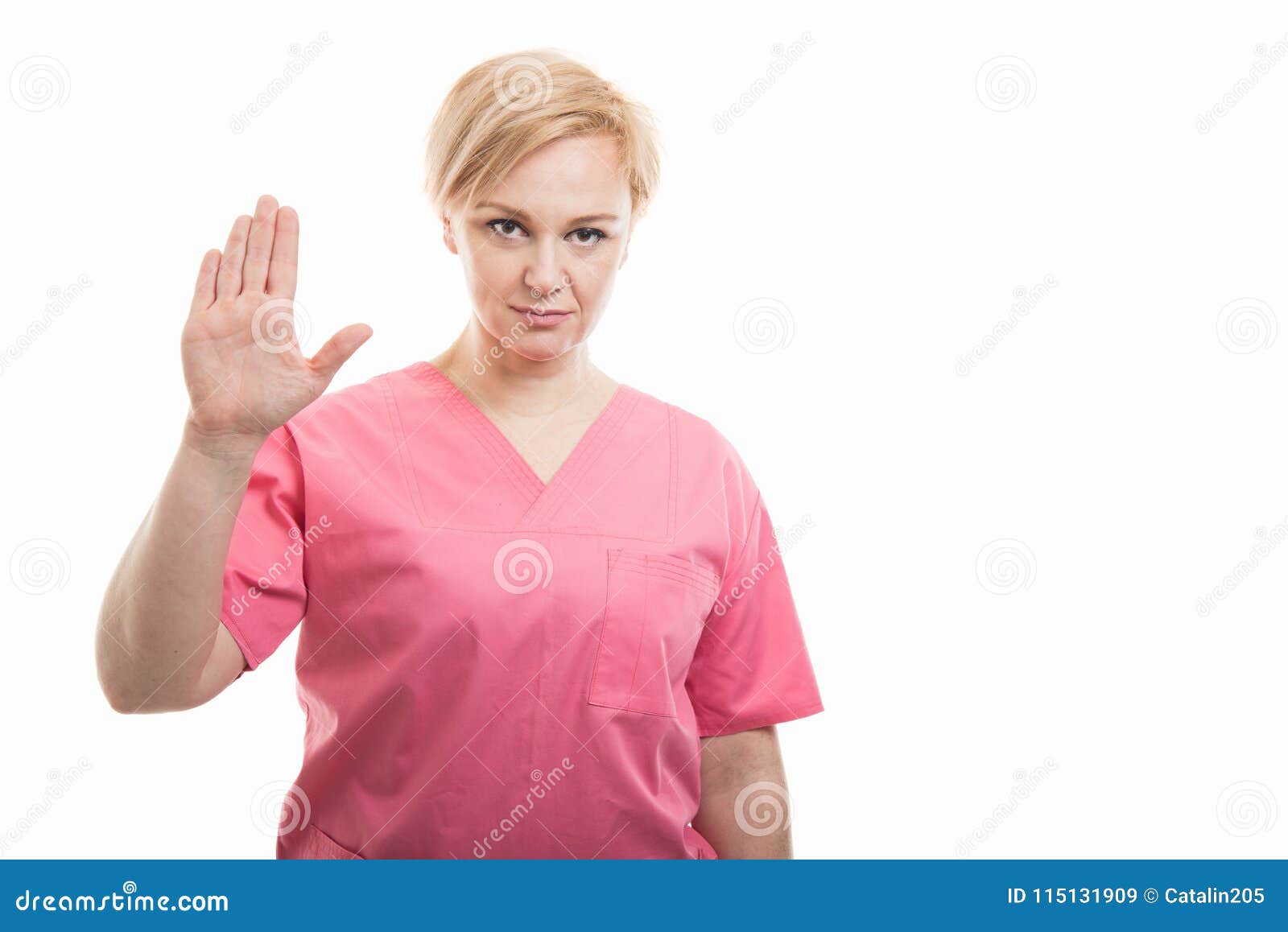 Attractive Female Nurse Wearing Pink Scrubs Taking Oath Gesture Stock