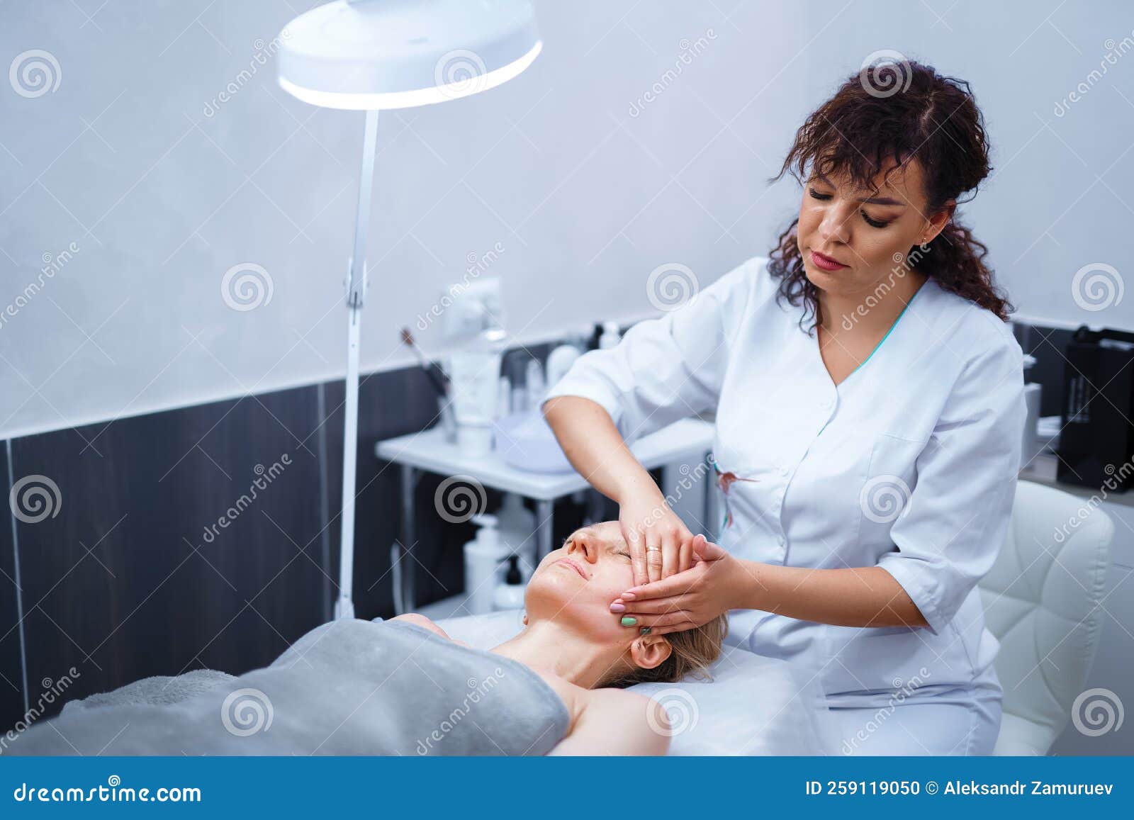 Attractive Female At Spa Health Club Getting A Facial Massage