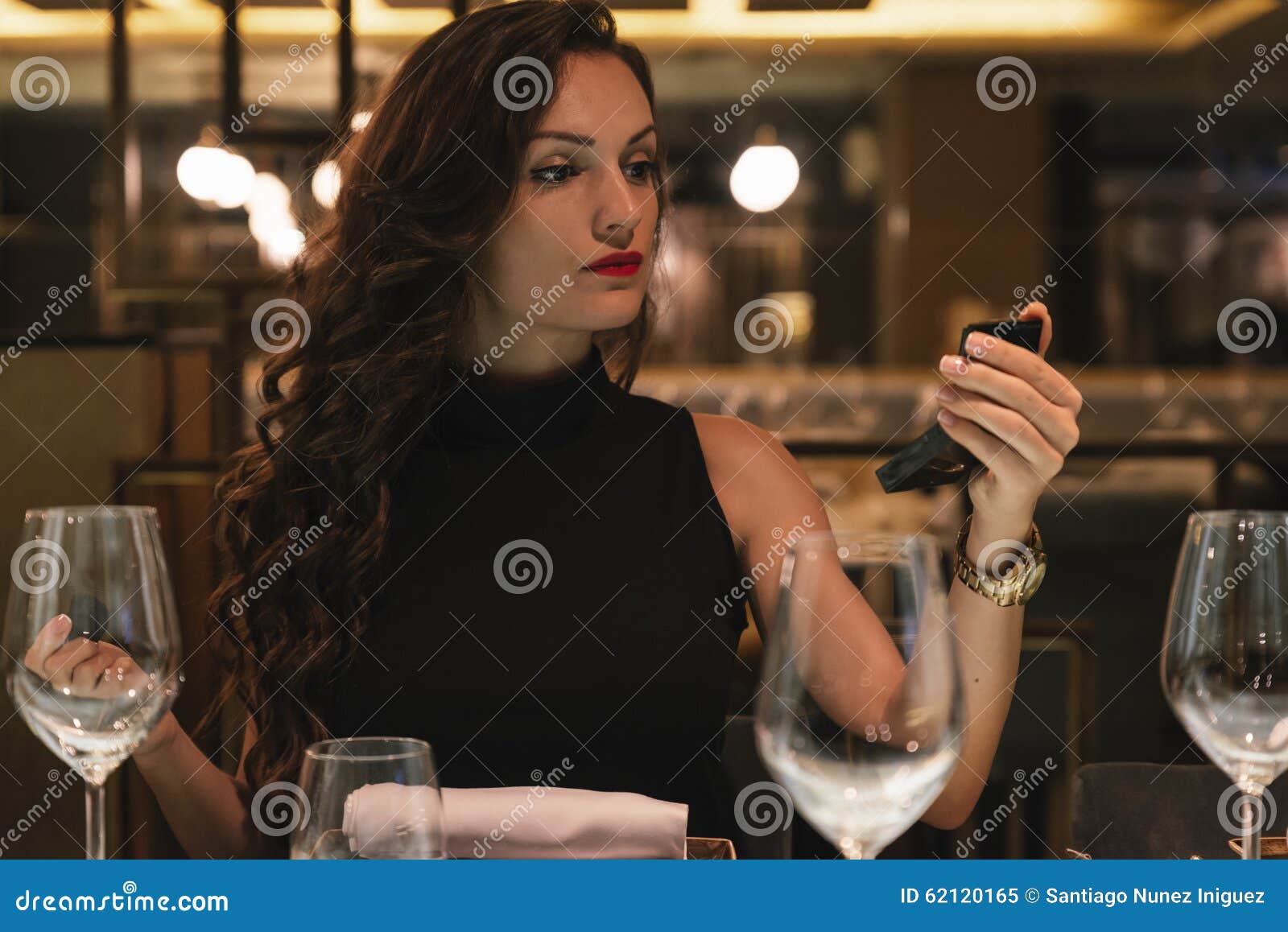 Attractive Female Use Mirror To Makeup in Restaurant Stock Image ...