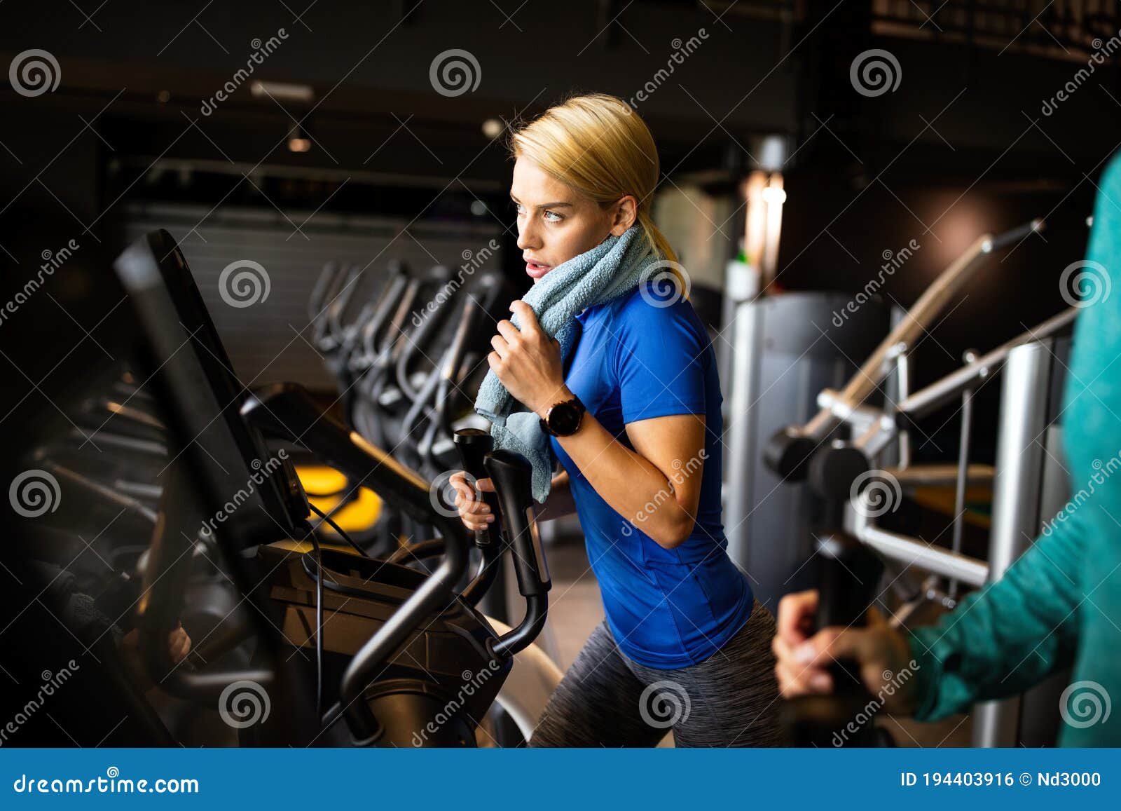 Attractive Fit Young Woman Using a Step Machine in the Gym Stock Photo ...