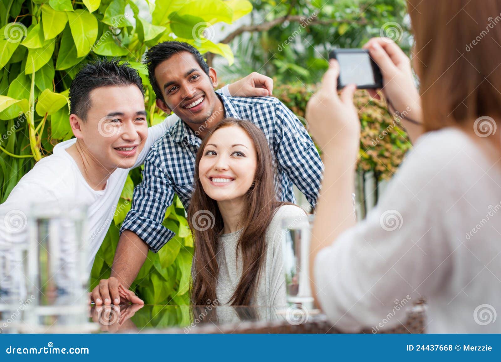 Attractive Friends Using a Camera To Take Photos Stock Photo - Image of ...