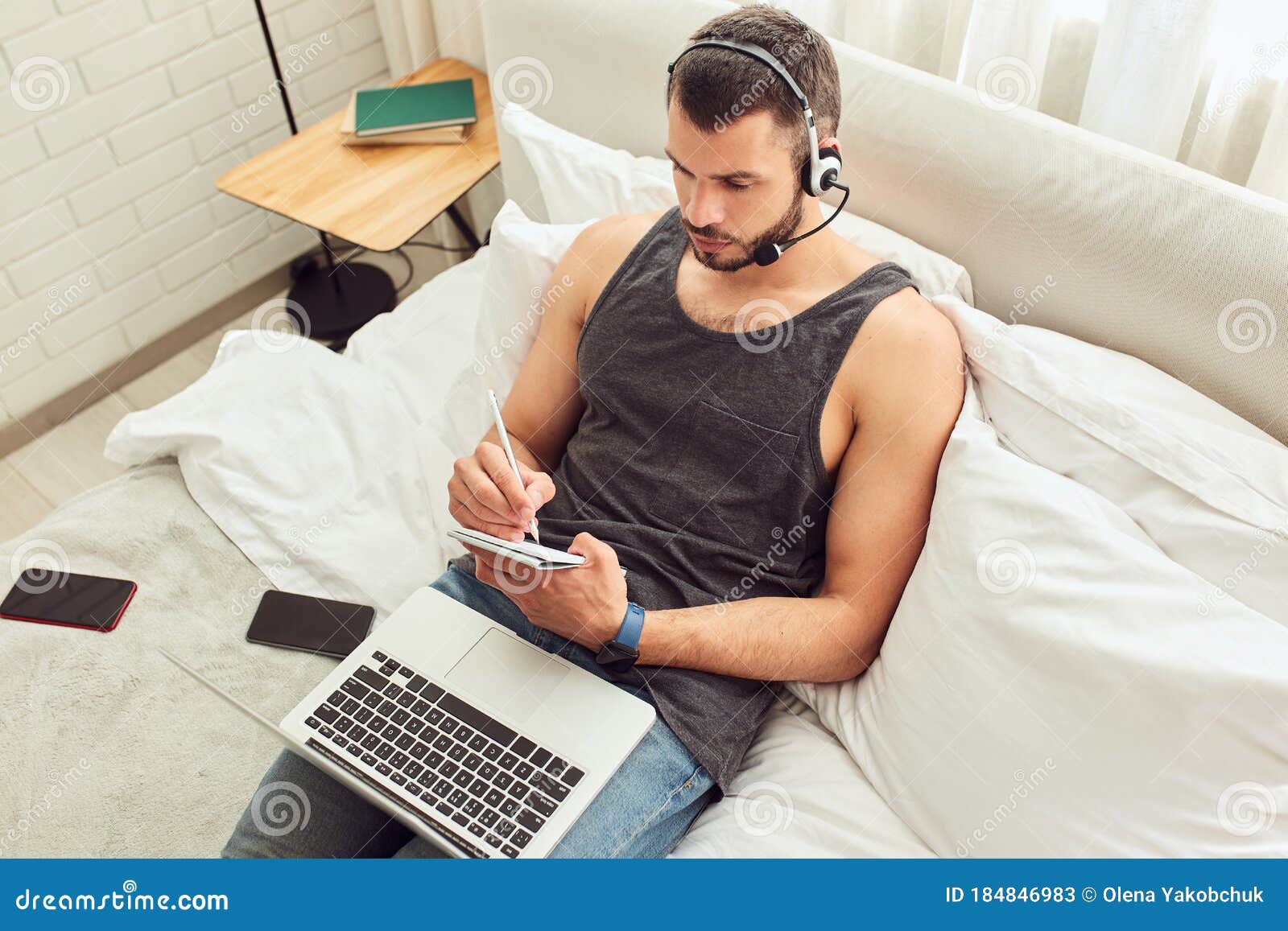 Handsome Young Man Using Notebook and Making Notes Stock Image - Image ...