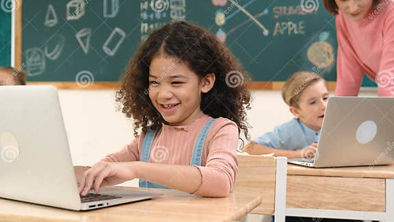 Attractive Girl Coding Prompt while Looking at Camera at STEM Class ...
