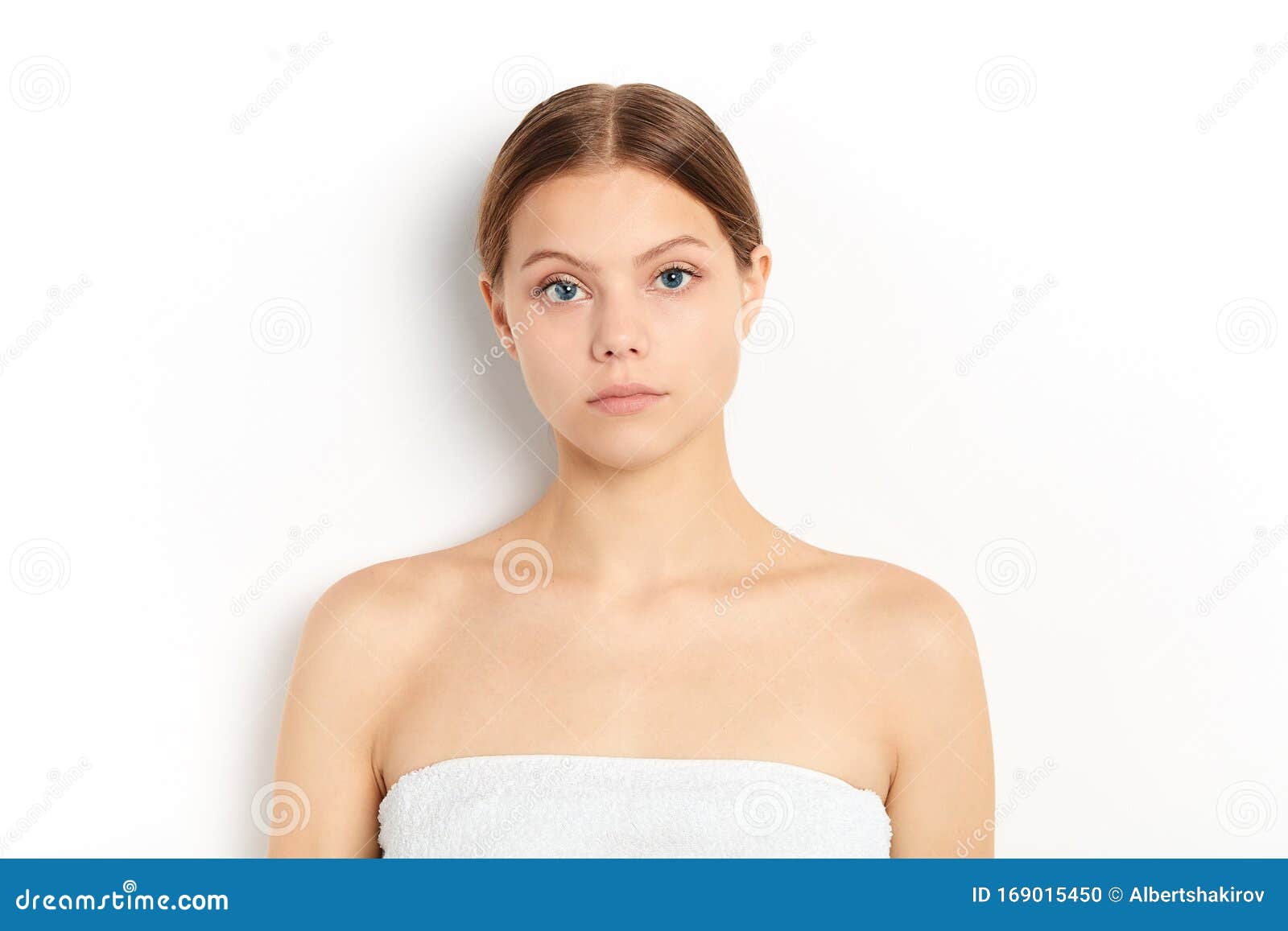 Attractive Girl With Healthy Skin And Nude Shoulders Looking At The