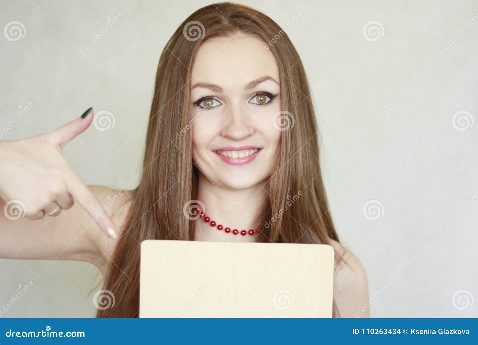 Attractive girl points stock photo. Image of banner - 110263434