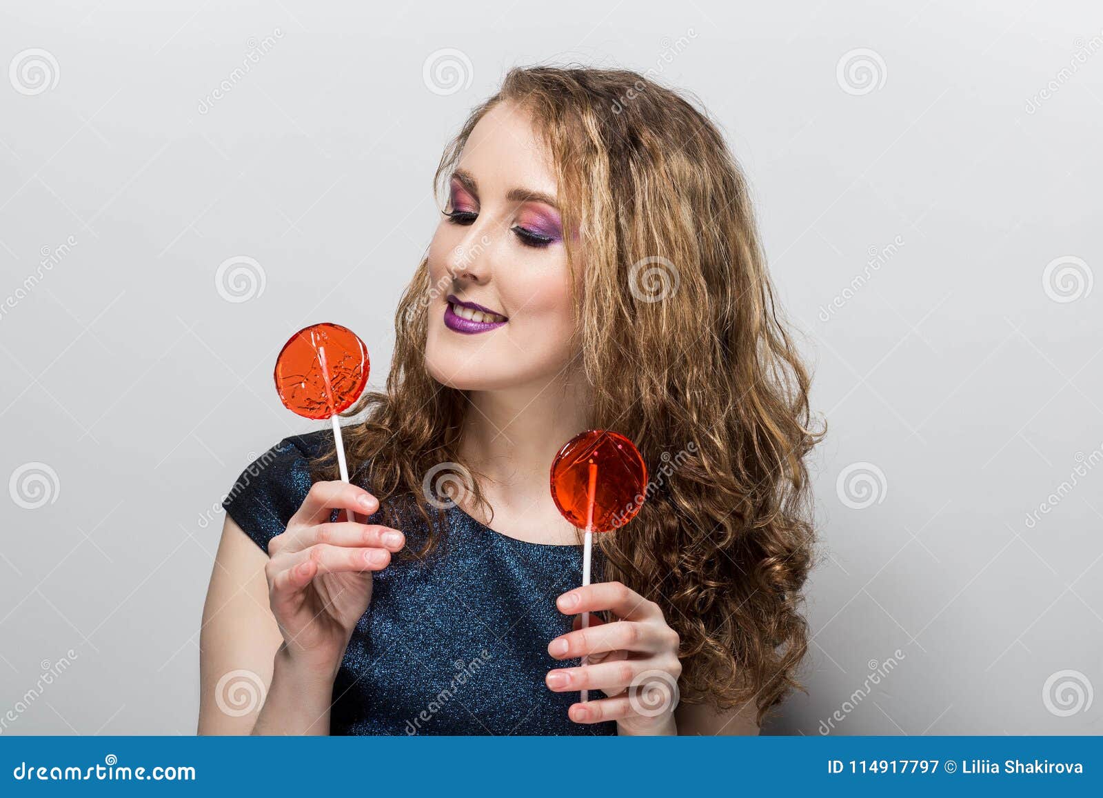 Attractive Girl Posing with Candy Stock Image - Image of looking, lick ...