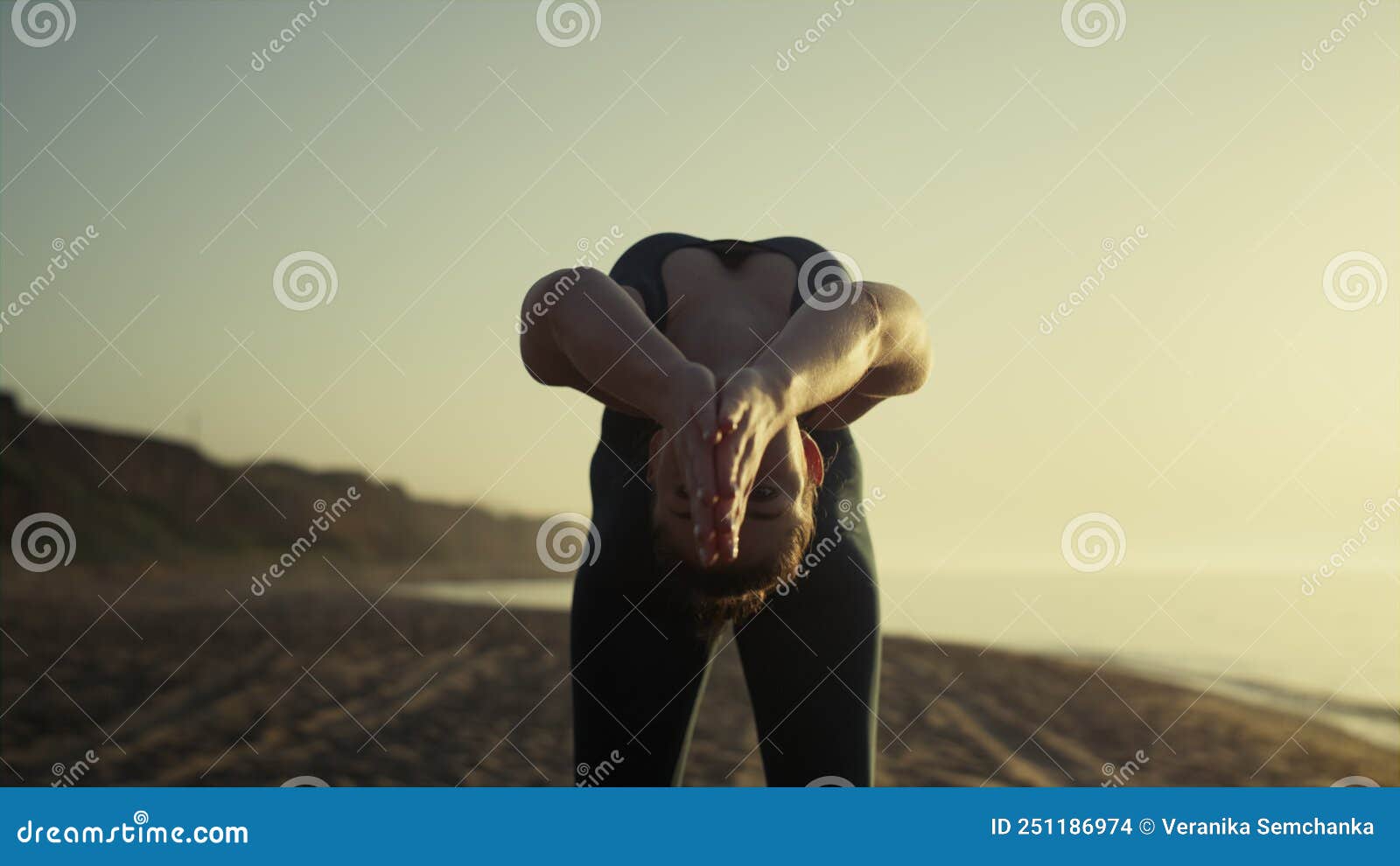 Attractive Girl Pulling Arms Back Practicing Bridge Pose at Sunset ...