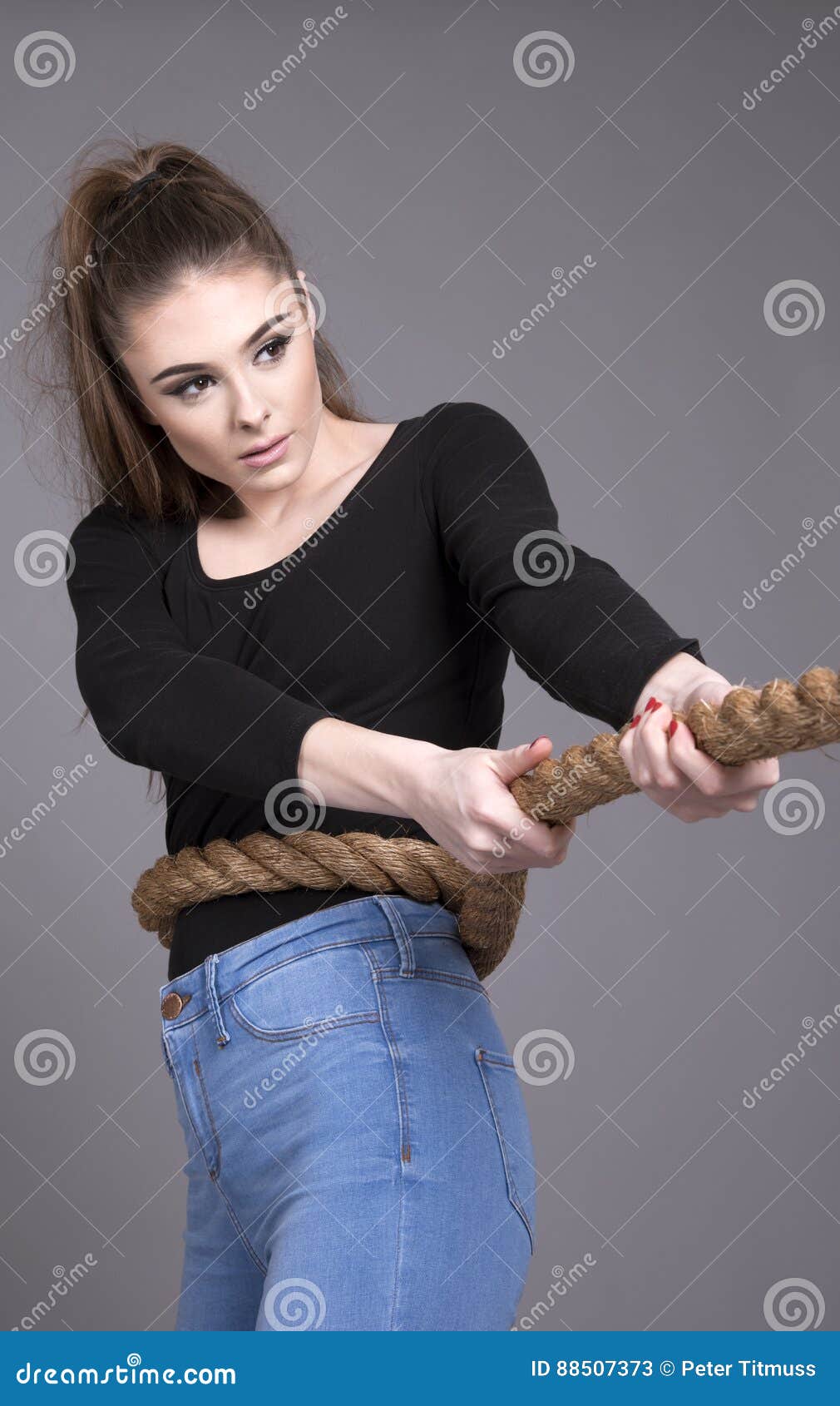 Attractive Girl Pulling a Rope Stock Image - Image of pull, attractive ...