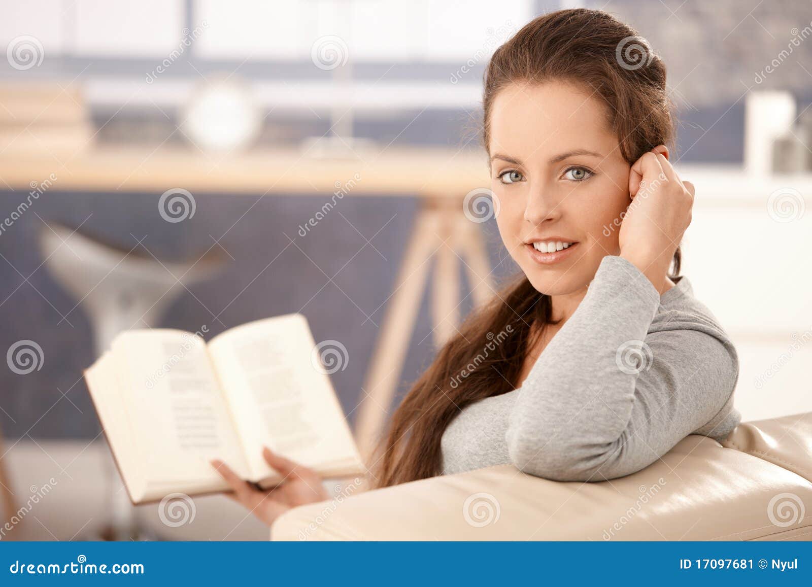 Attractive Girl Reading Book on Sofa at Home Stock Image - Image of ...