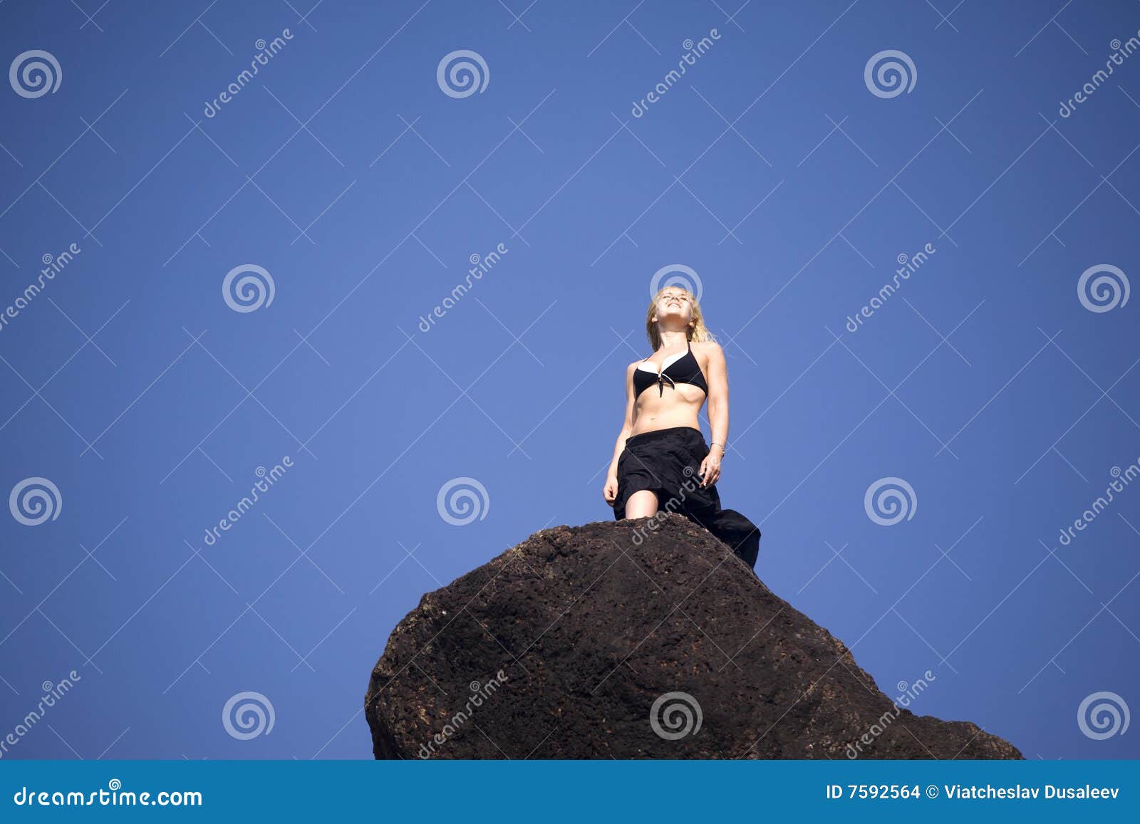 Attractive girl on rock stock photo. Image of relax, rest - 7592564