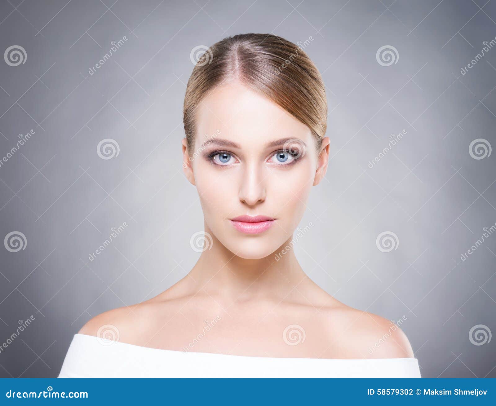 Attractive Girl with Smooth Skin Over the Grey Background Stock Photo ...