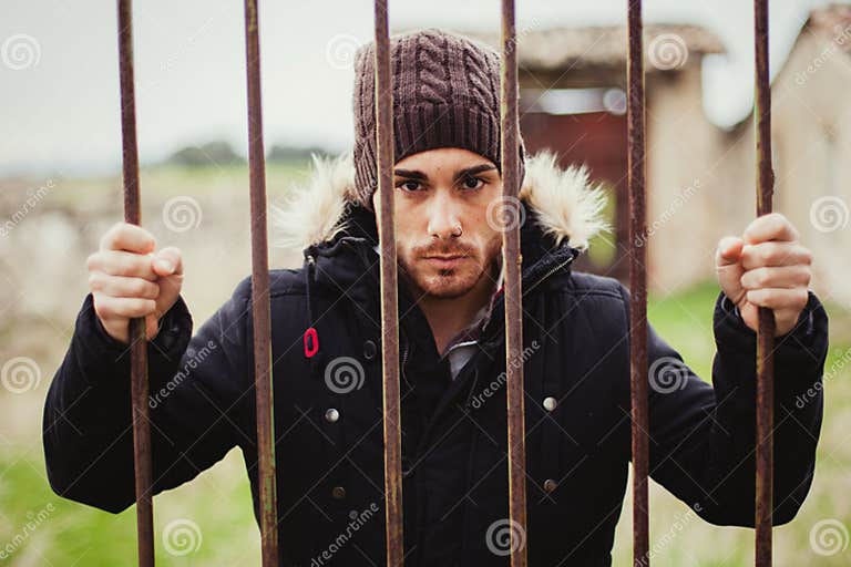 Attractive Guy Behide the Bars Stock Photo - Image of male, lifestyle ...