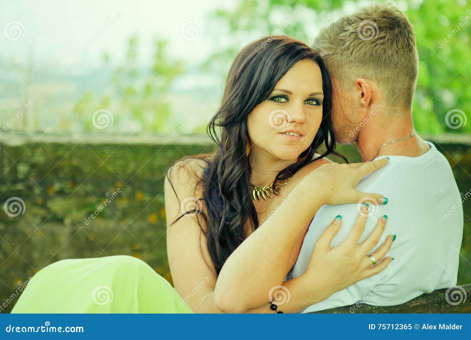 Attractive the Guy with the Girl Sit and Embrace on a Bench Stock Image ...