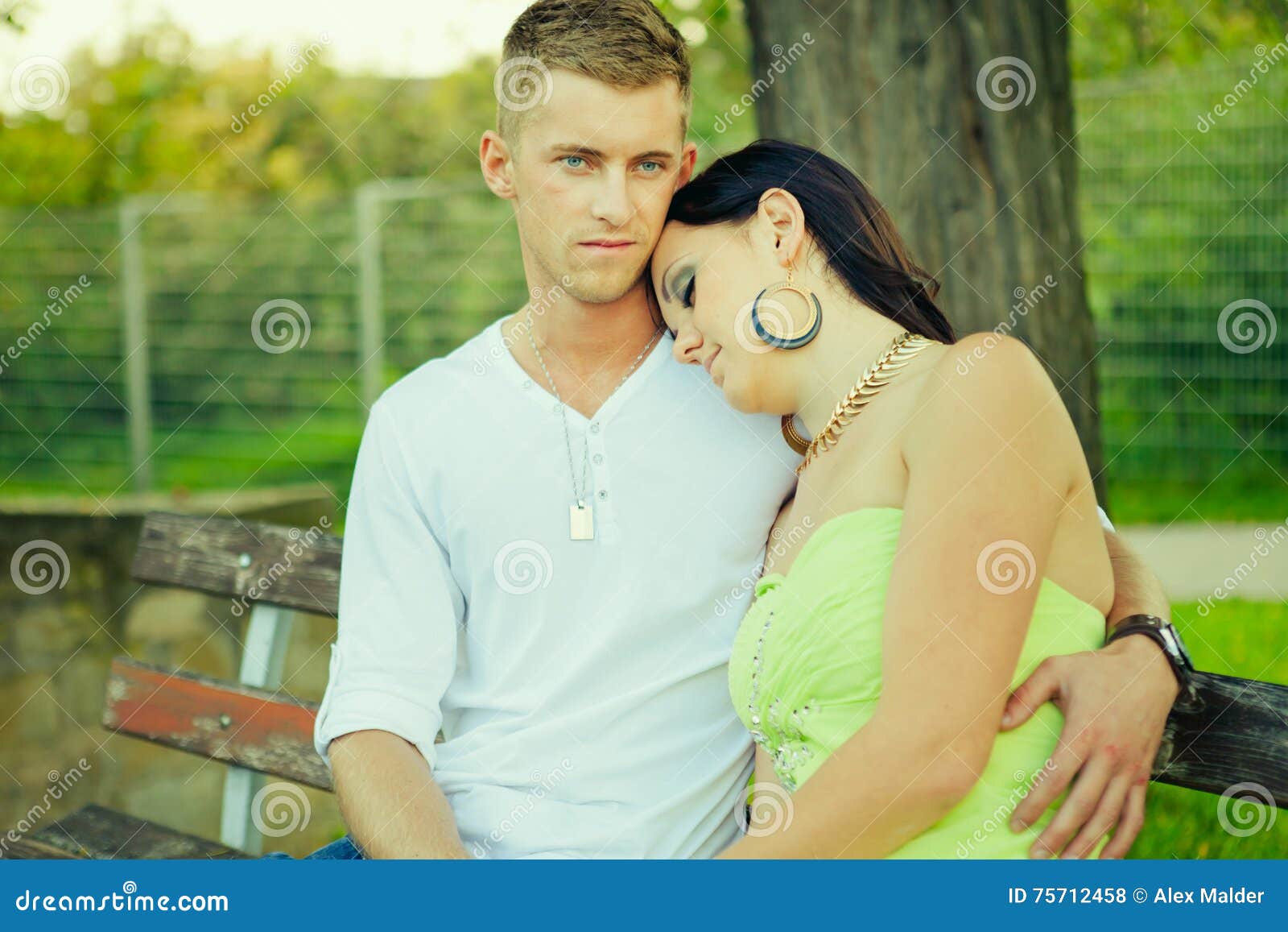 Attractive the Guy with the Girl Sit and Embrace on a Bench Stock Photo ...