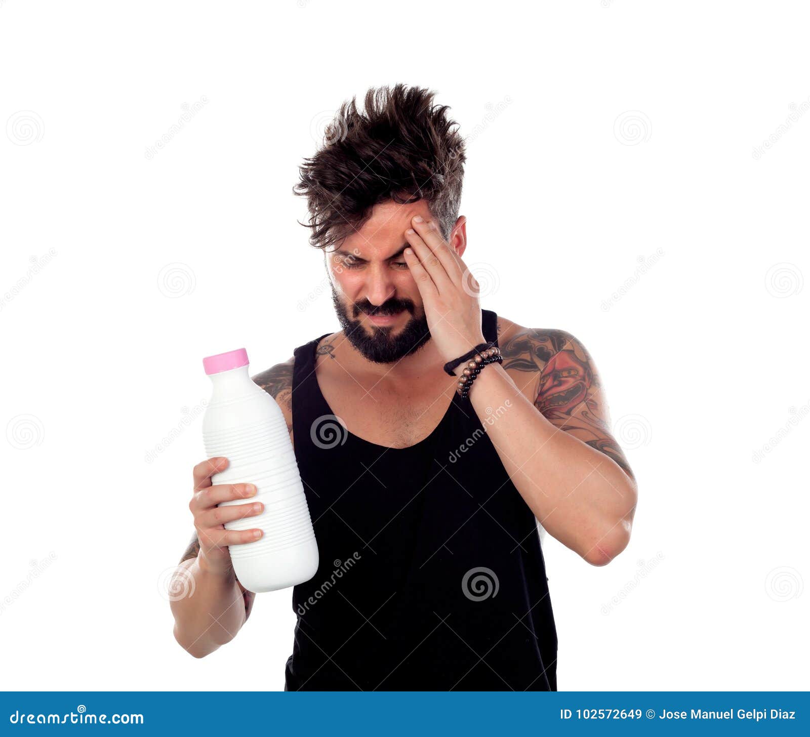 Attractive Guy With Headache Holding A Milk Bottle Stock Image Image Of Isolated Hold 102572649