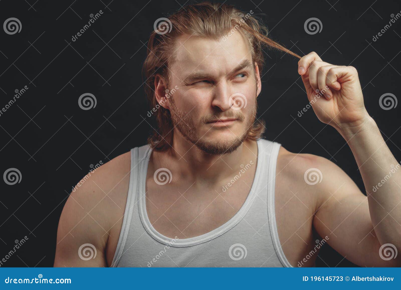 Attractive Guy is Looking at His Extra Hair. Odd Hair Stock Image ...