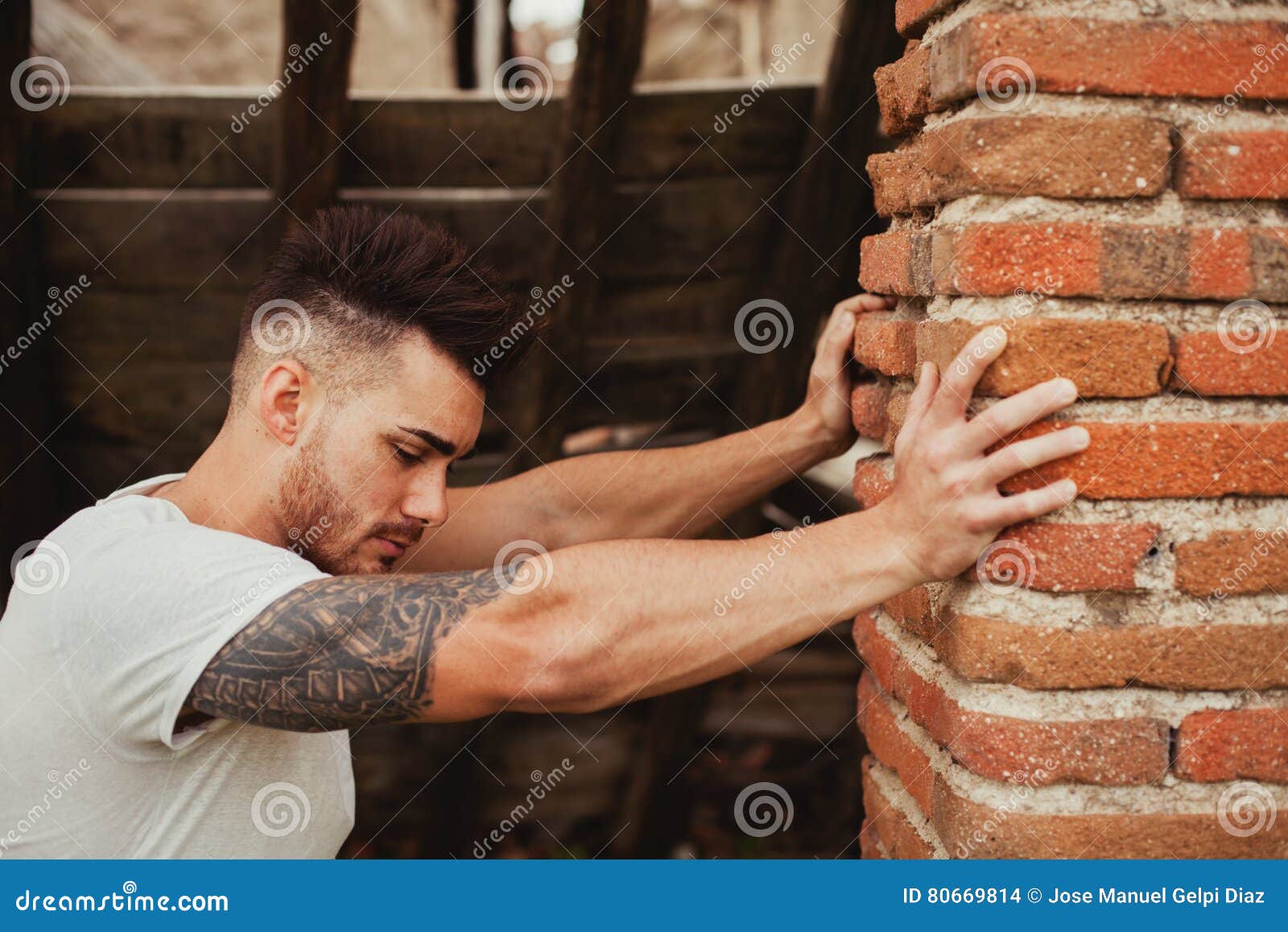 Attractive Guy Next To a Brick Wall Stock Photo - Image of body ...