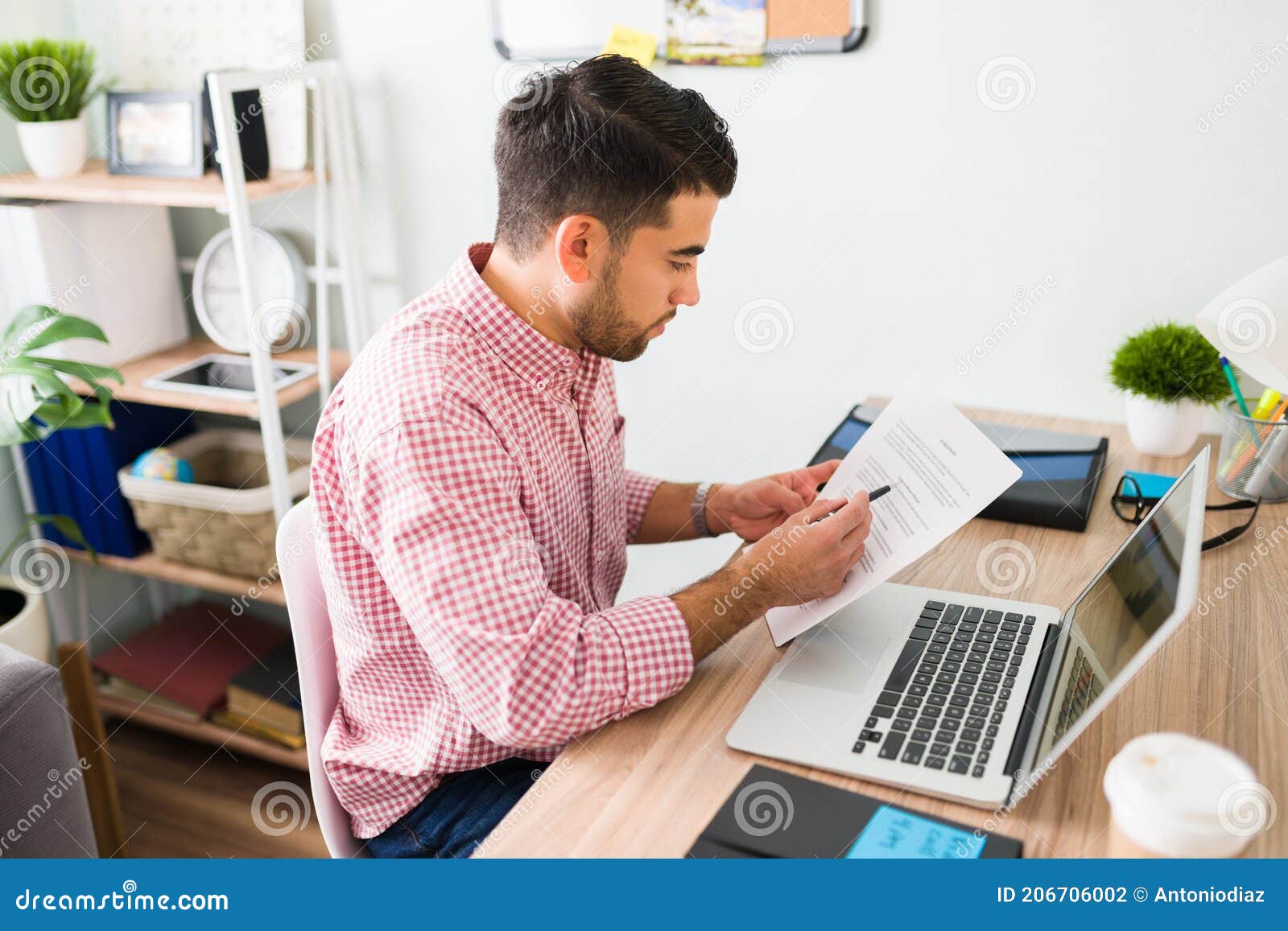 Attractive Guy Reviewing Some Work Documents in His Office Stock Photo ...