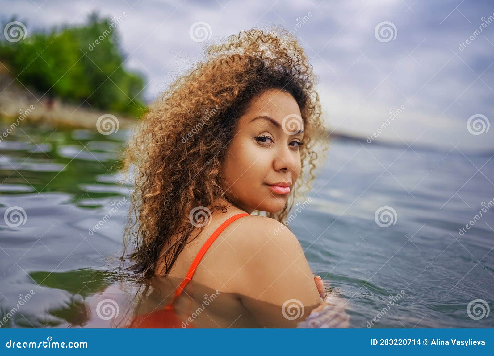 Attractive Happy Plus Size African American Black Woman Enjoys Swimming
