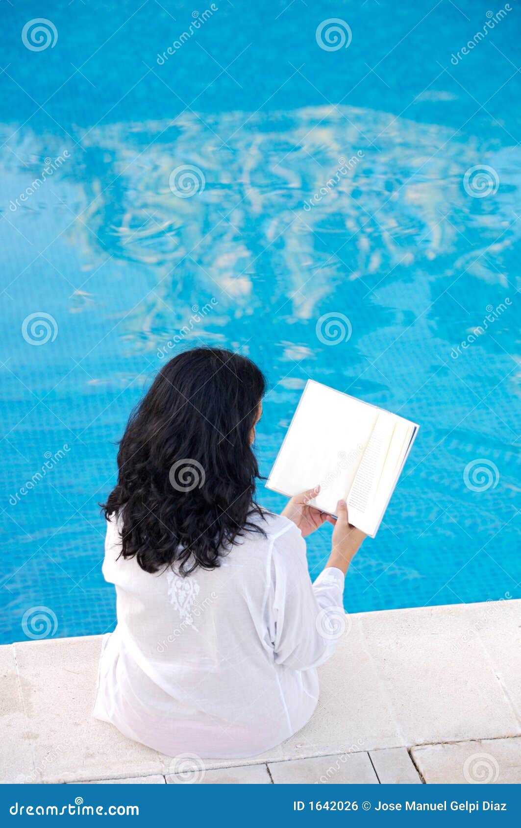 Attractive Lady Reading in the Swimming Pool Stock Photo - Image of ...