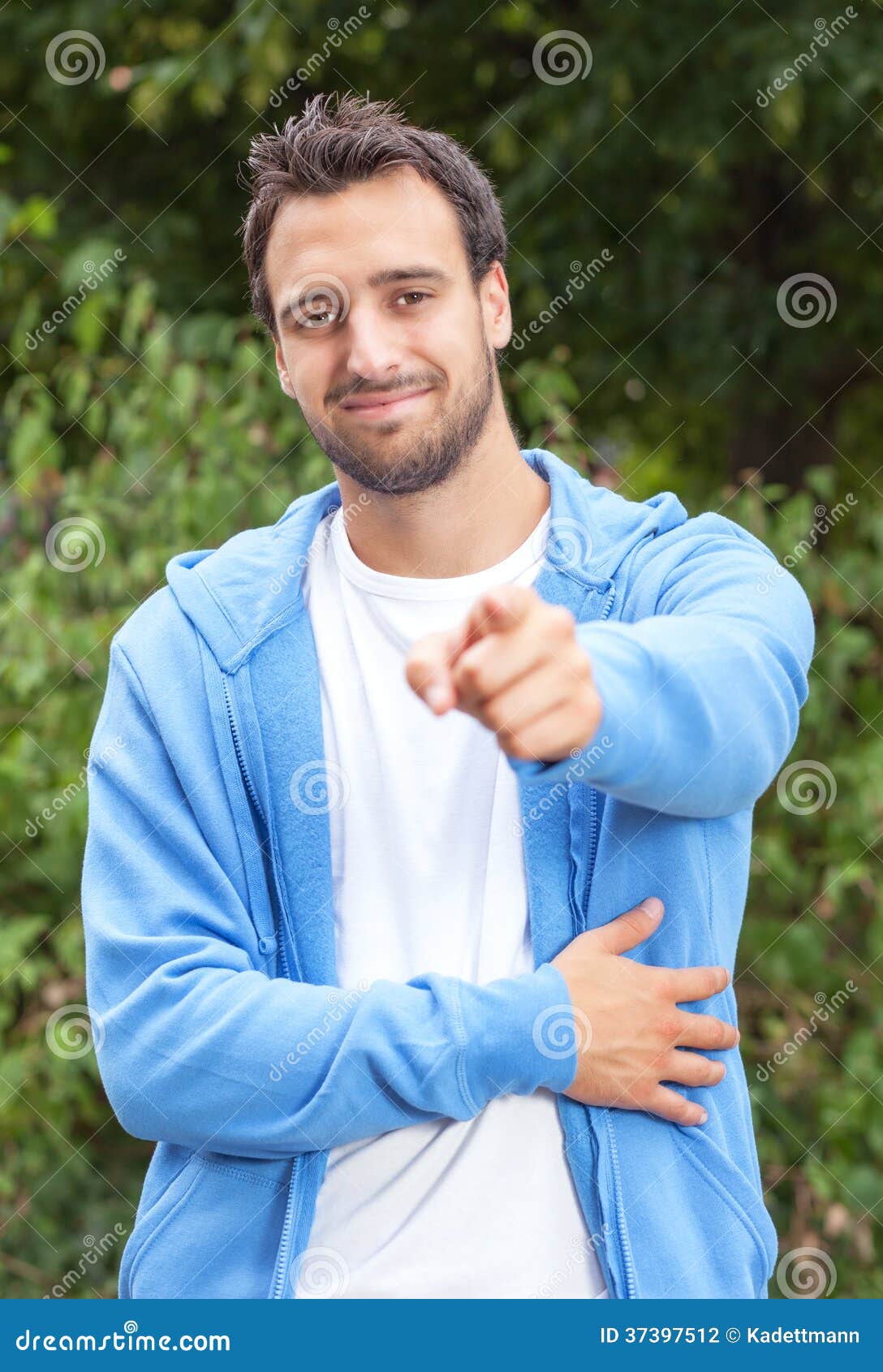 Attractive Latin Guy Pointing at Camera in a Park Stock Photo - Image ...