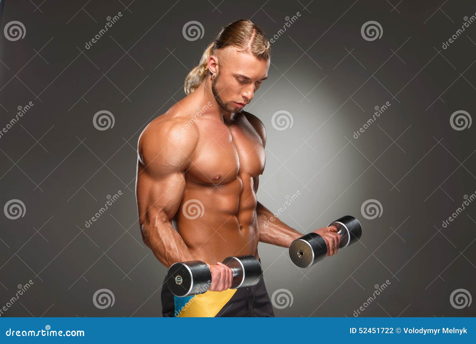 Attractive Male Body Builder on Gray Background Stock Photo - Image of ...