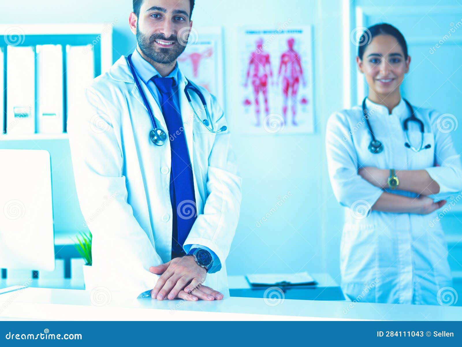 Attractive Male Doctor in Front of Medical Group Stock Image - Image of ...