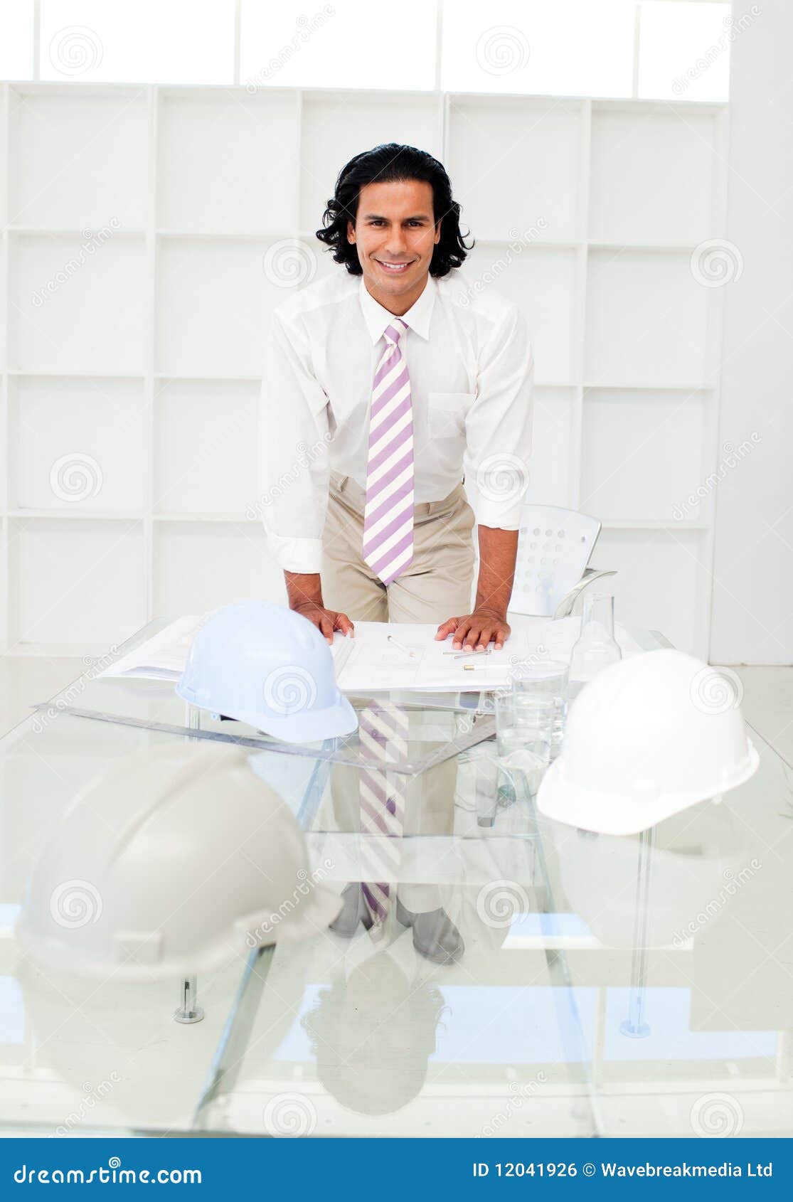 Attractive Male Engineer Studying Blueprints Stock Photo - Image of ...