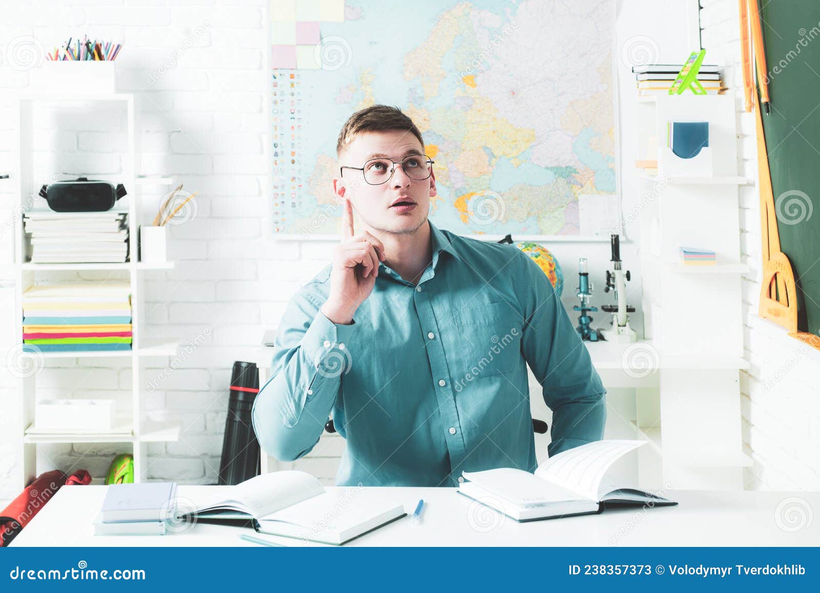 Attractive Male University Student Doing Some Homework in Class. Stock ...